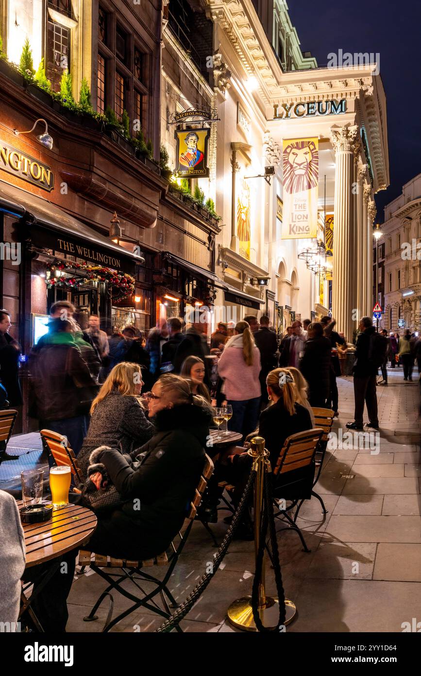 A Group of Young Women Sitting Outside The Wellington Pub Drinking ...
