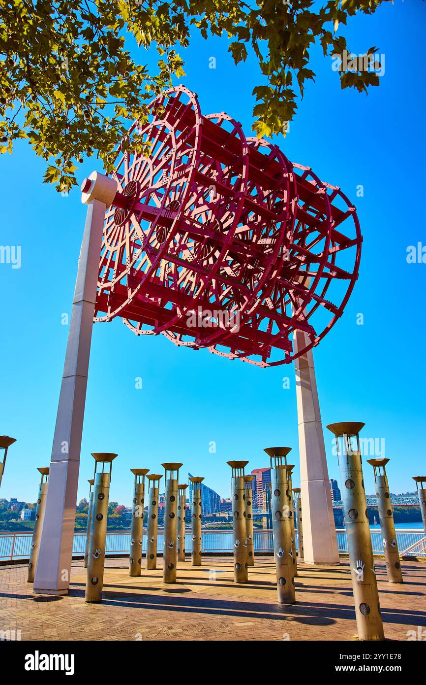 Red Paddle Wheel Sculpture with Cityscape Backdrop Low Perspective ...