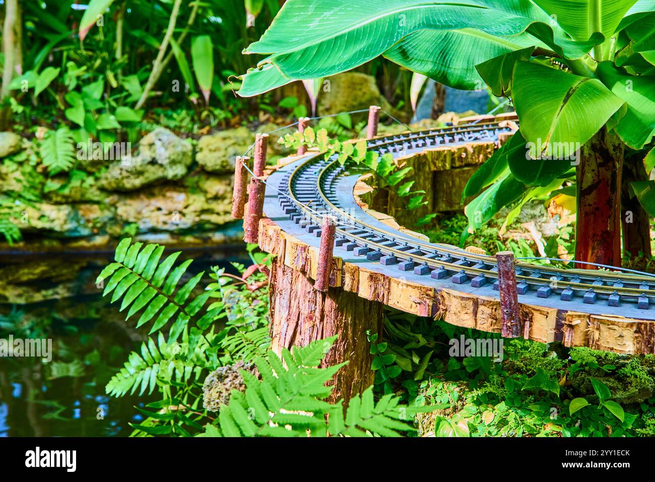 Miniature Jungle Railway Model in Lush Garden Eye-Level View Stock ...