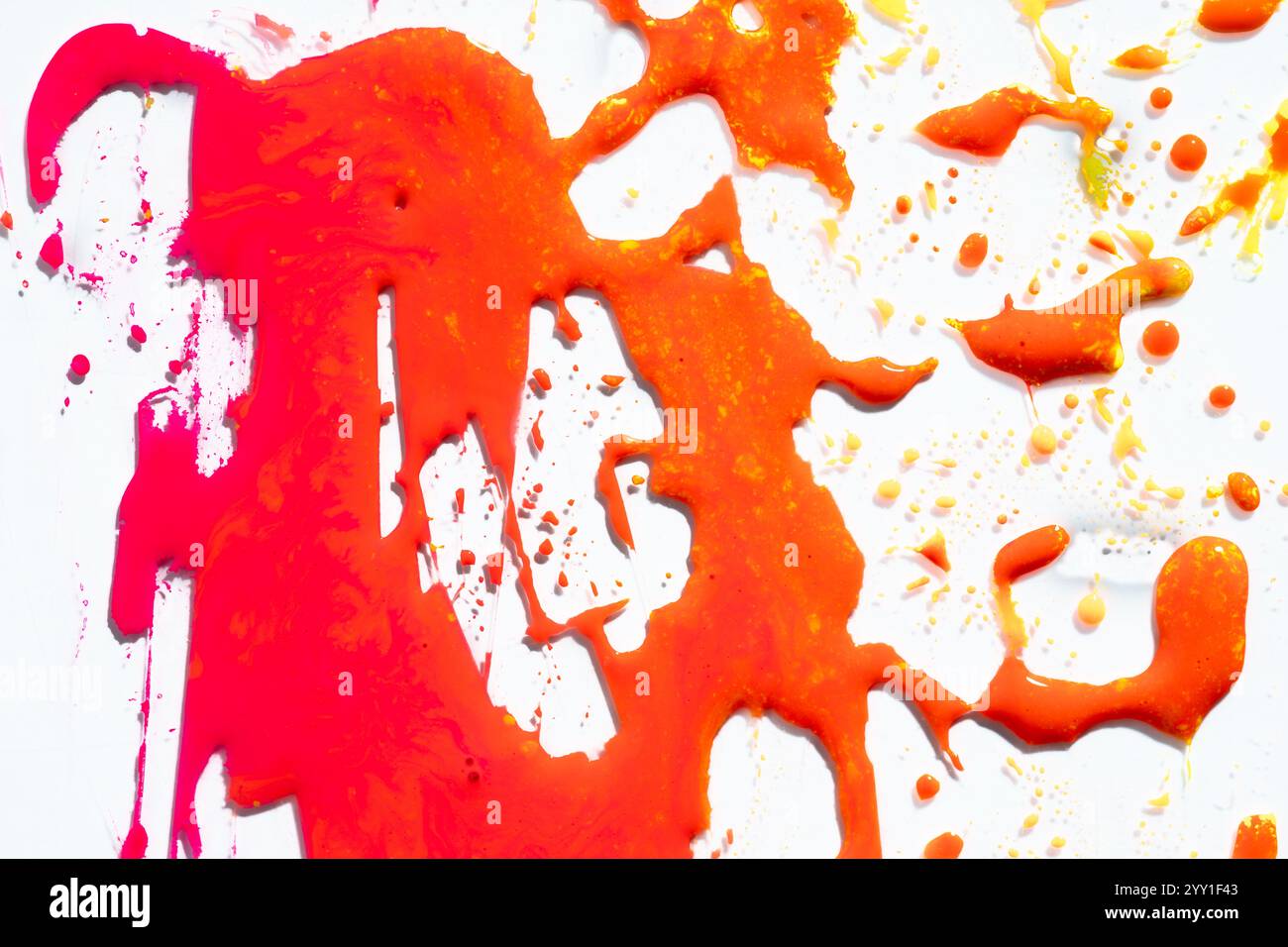 Abstract vibrant orange wet paint drops and splotch on white background ...