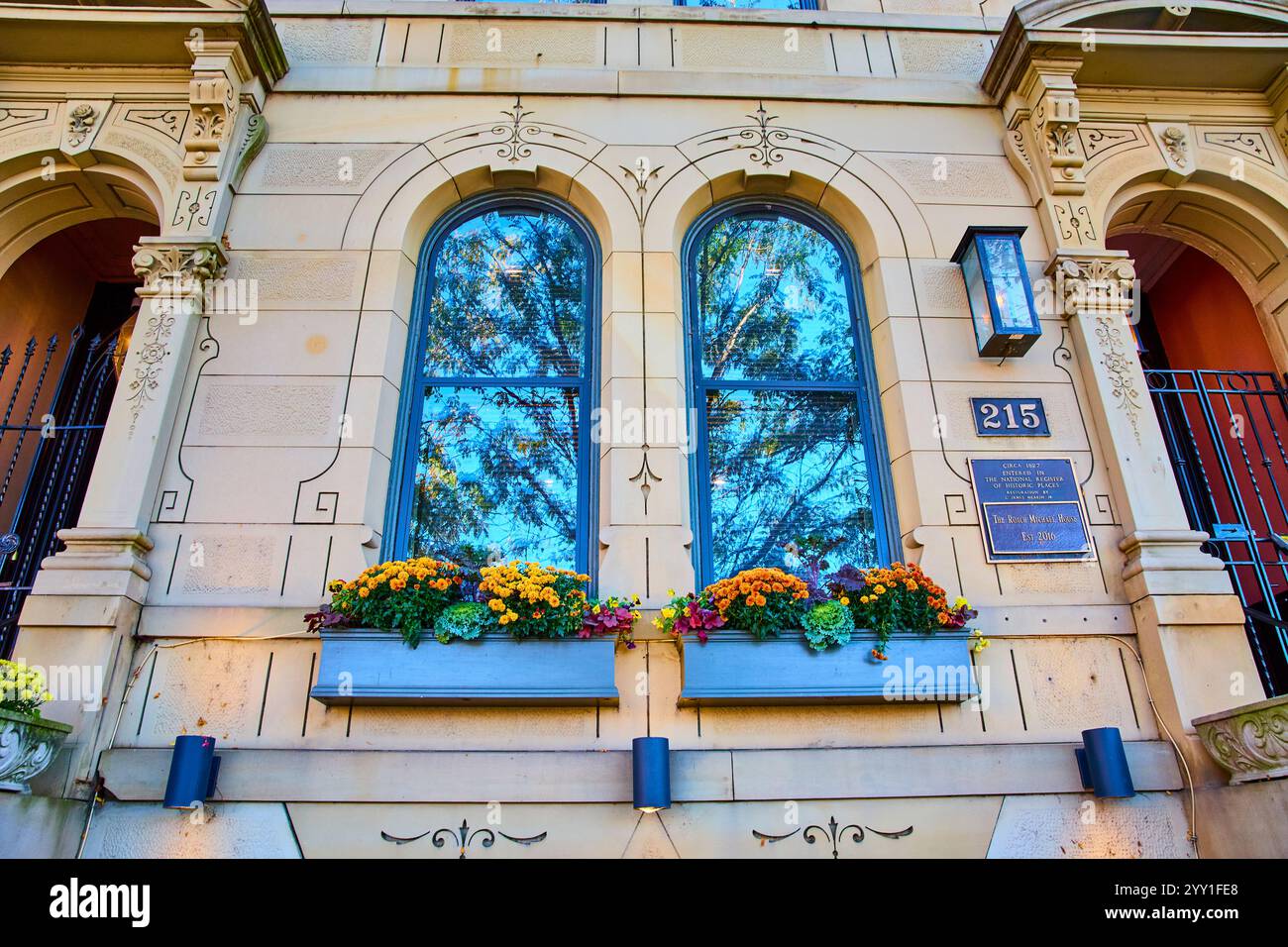 Historic Building Facade with Floral Accents Eye-Level View Stock Photo ...