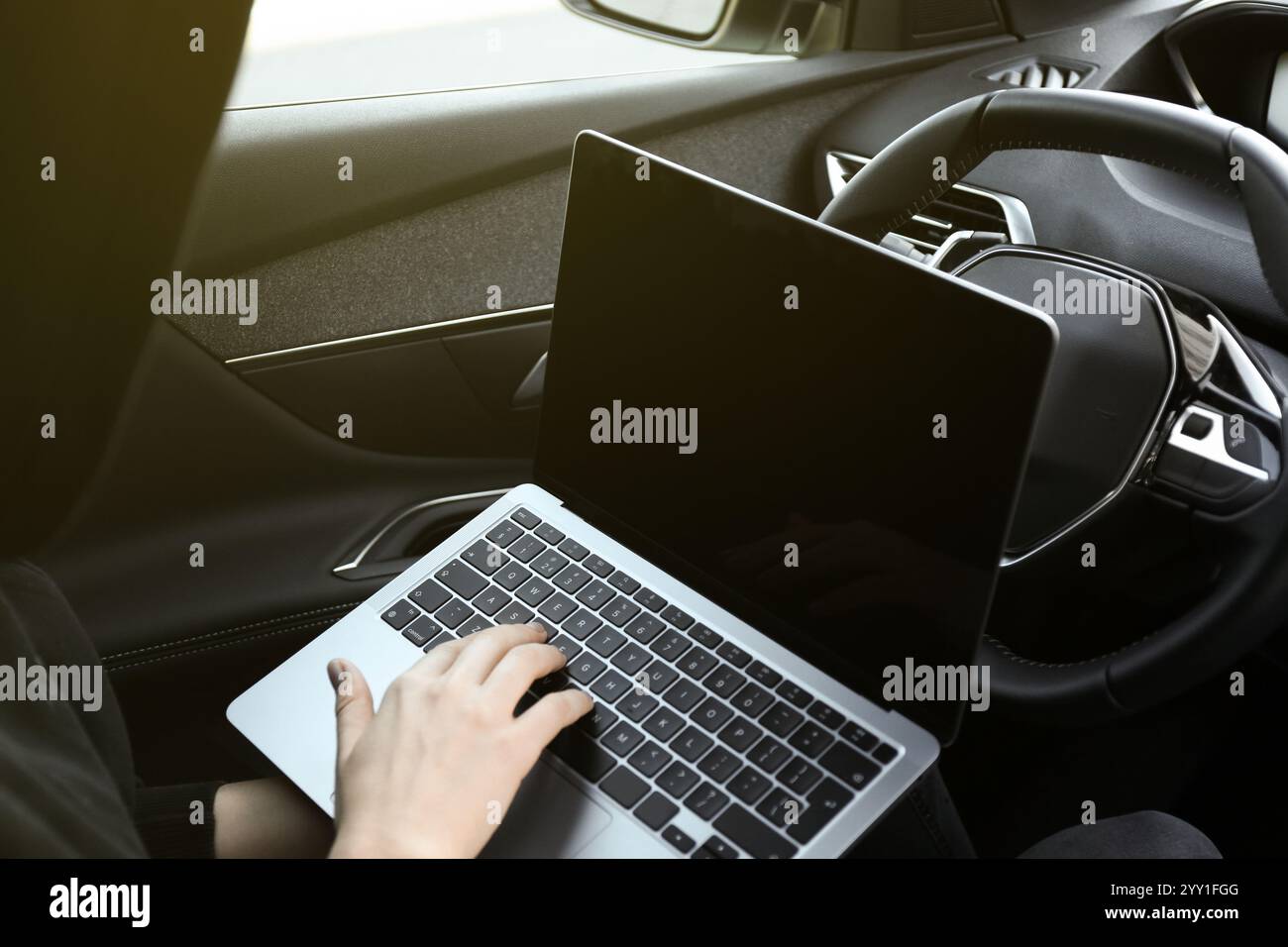 Thief hacking car system with laptop inside vehicle, closeup Stock ...
