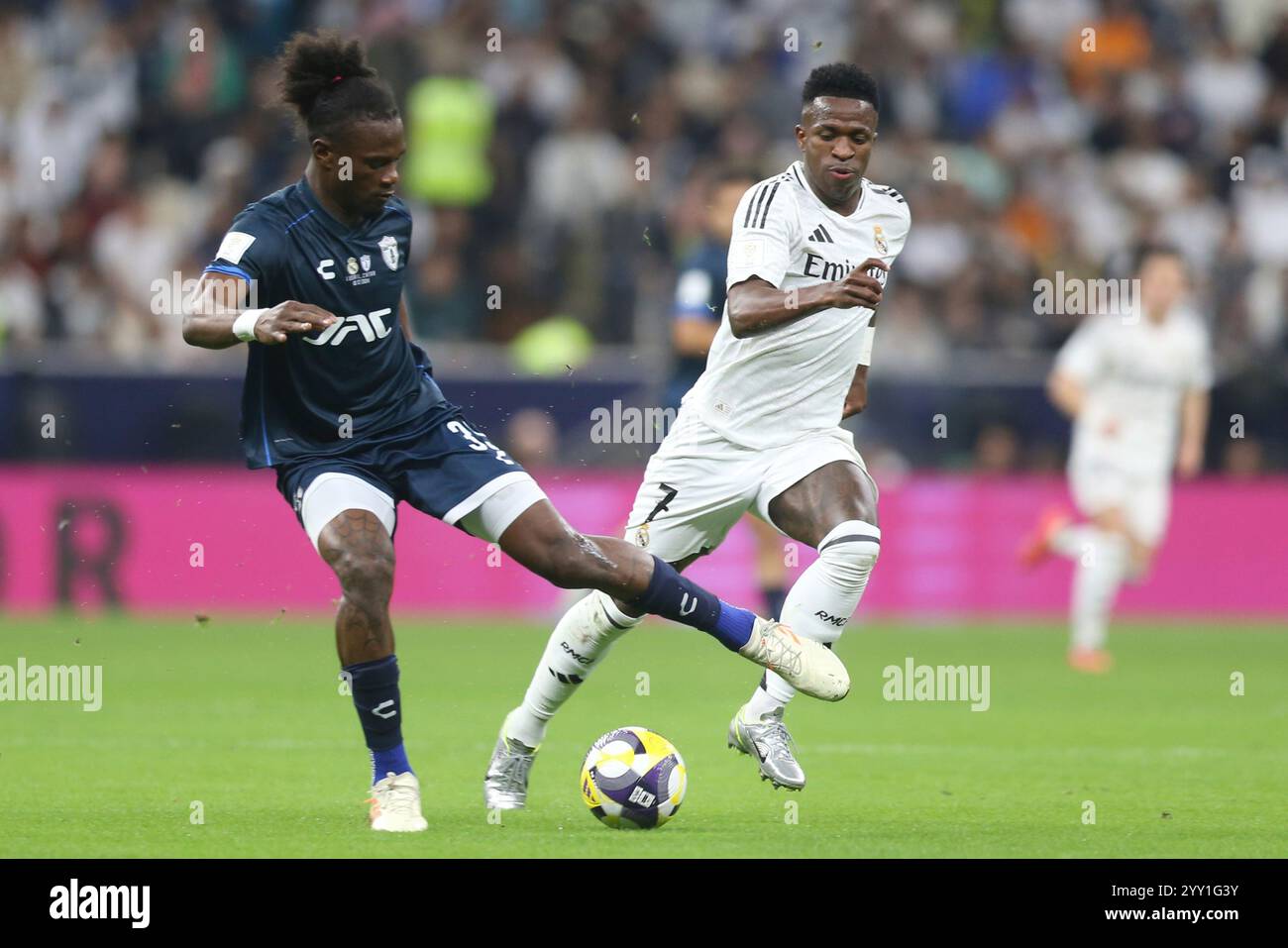 CF Pachuca's Andres Micolta, left, and Real Madrid's Vinicius Junior ...