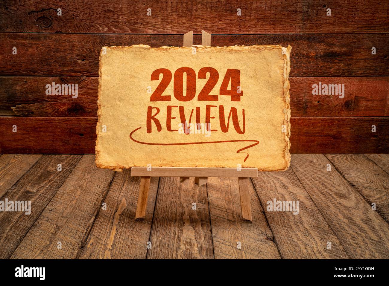 2024 year review - easel sign with antique paper against rustic wood ...