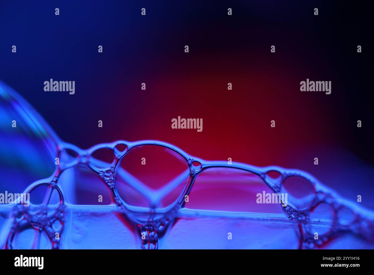 Blue fantastic reflections on black background, liquid abstraction ...