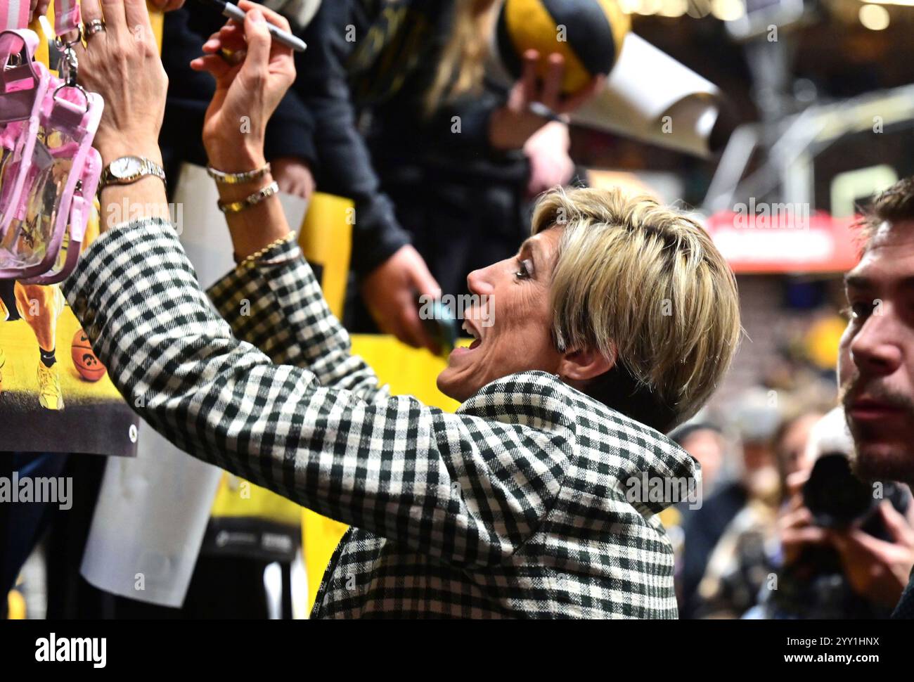 IOWA CITY, IA - DECEMBER 11: Iowa coach Jan Jenson signs autographs for ...