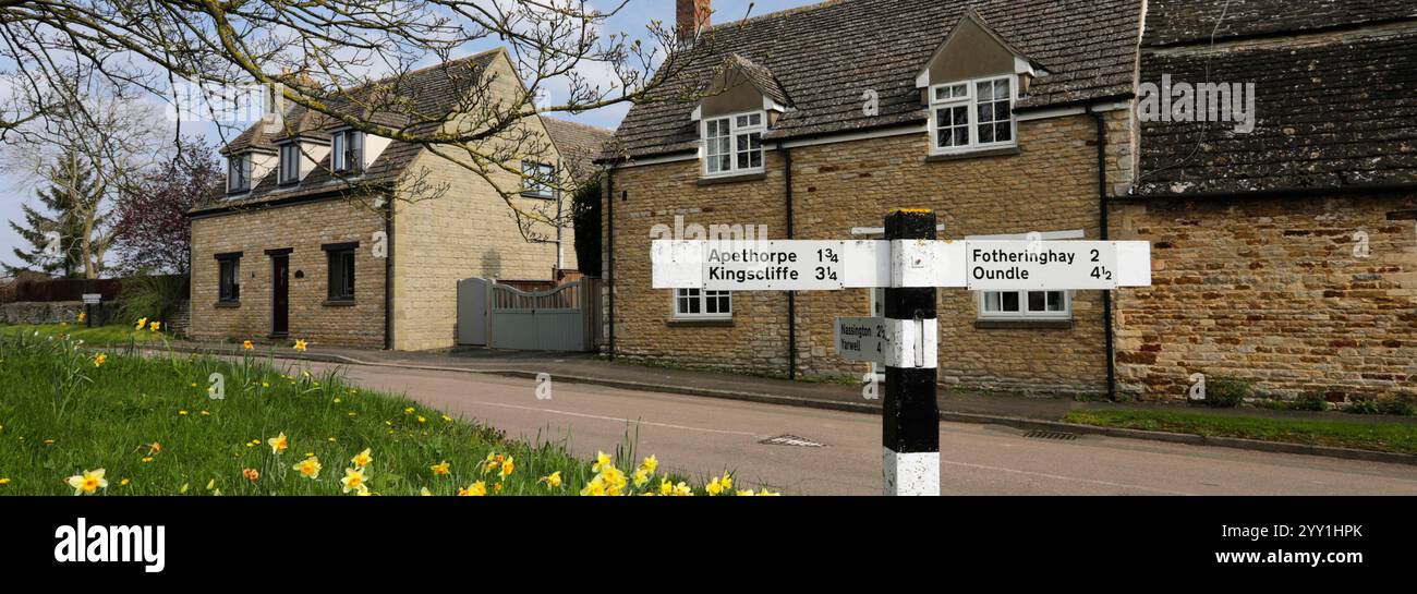 Spring view of the village sign, Woodnewton village, Northamptonshire ...