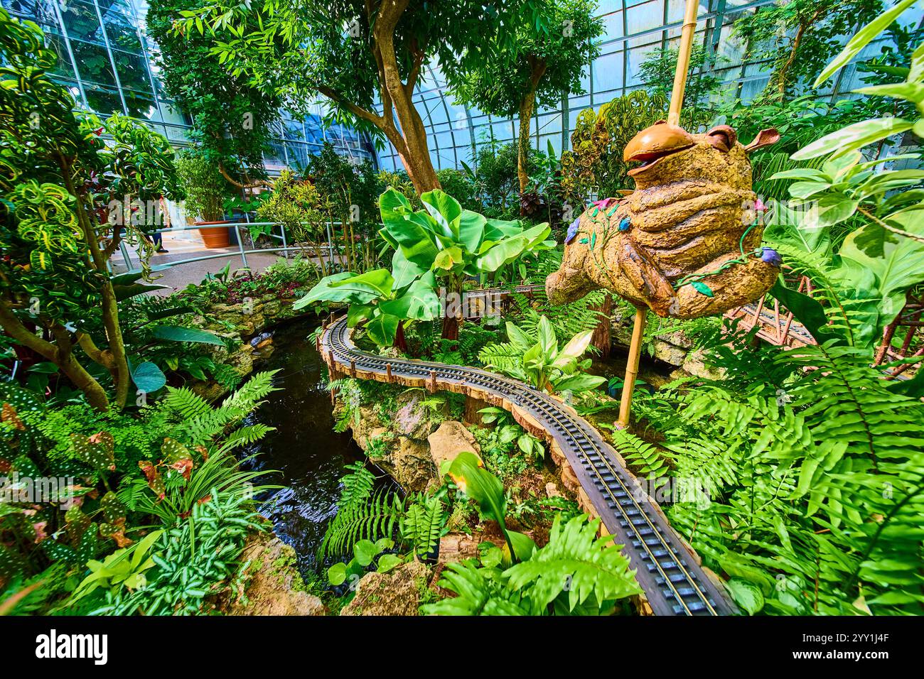 Whimsical Train and Fantasy Sculpture in Lush Conservatory Eye Level ...