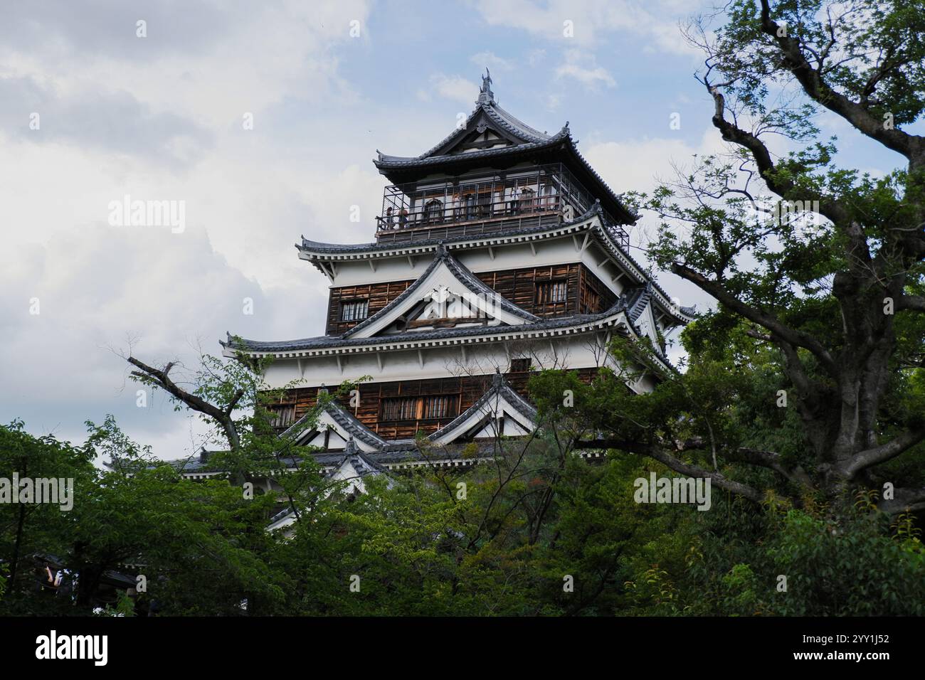 Stunning View of Osaka Castle Surrounded by Lush Greenery and Trees ...