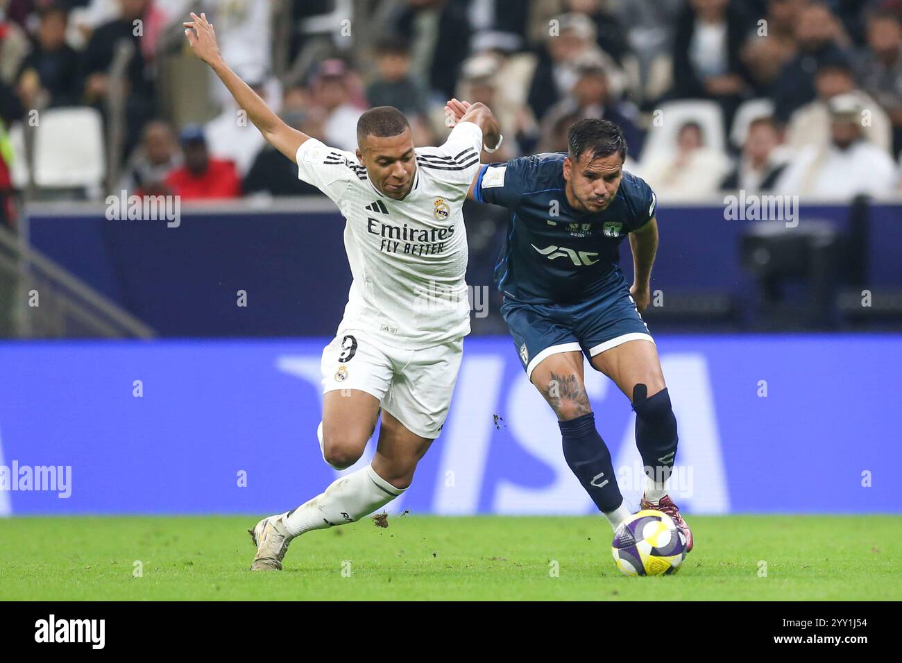 Real Madrid's Kylian Mbappe, left, and CF Pachuca's Sergio Barreto ...