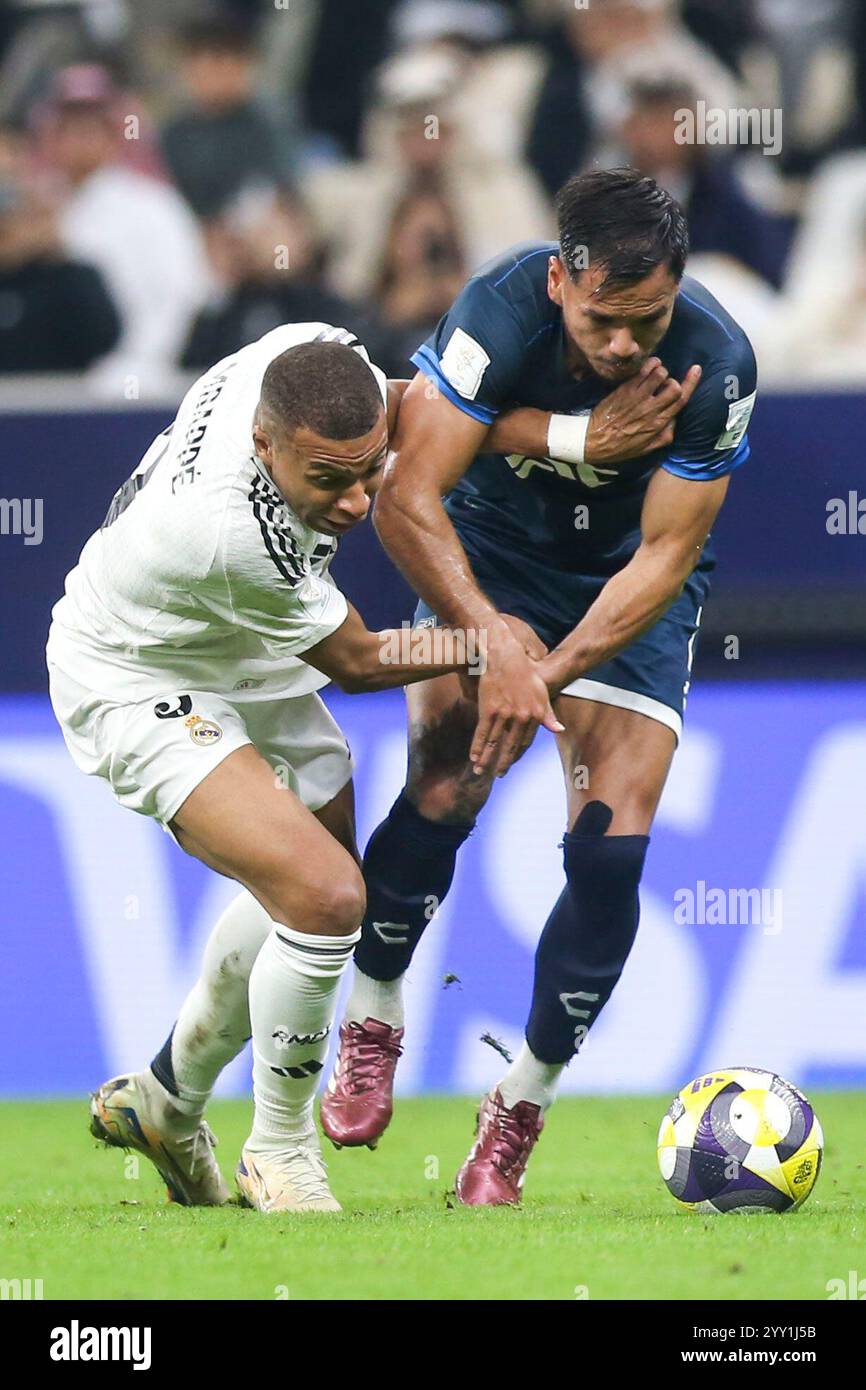 Real Madrid's Kylian Mbappe, left, and CF Pachuca's Sergio Barreto ...
