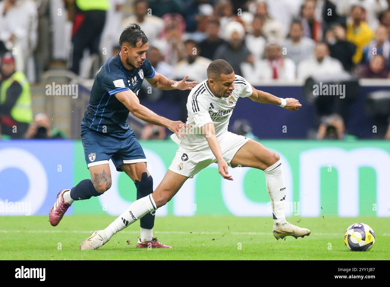 Real Madrid's Kylian Mbappe, right, and CF Pachuca's Sergio Barreto ...
