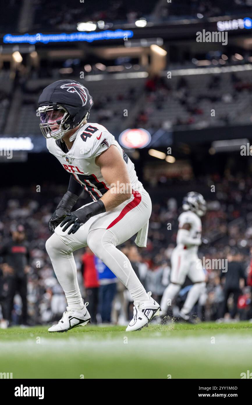 Atlanta Falcons linebacker JD Bertrand (40) warms up wearing a guardian cap on his helmet before ...