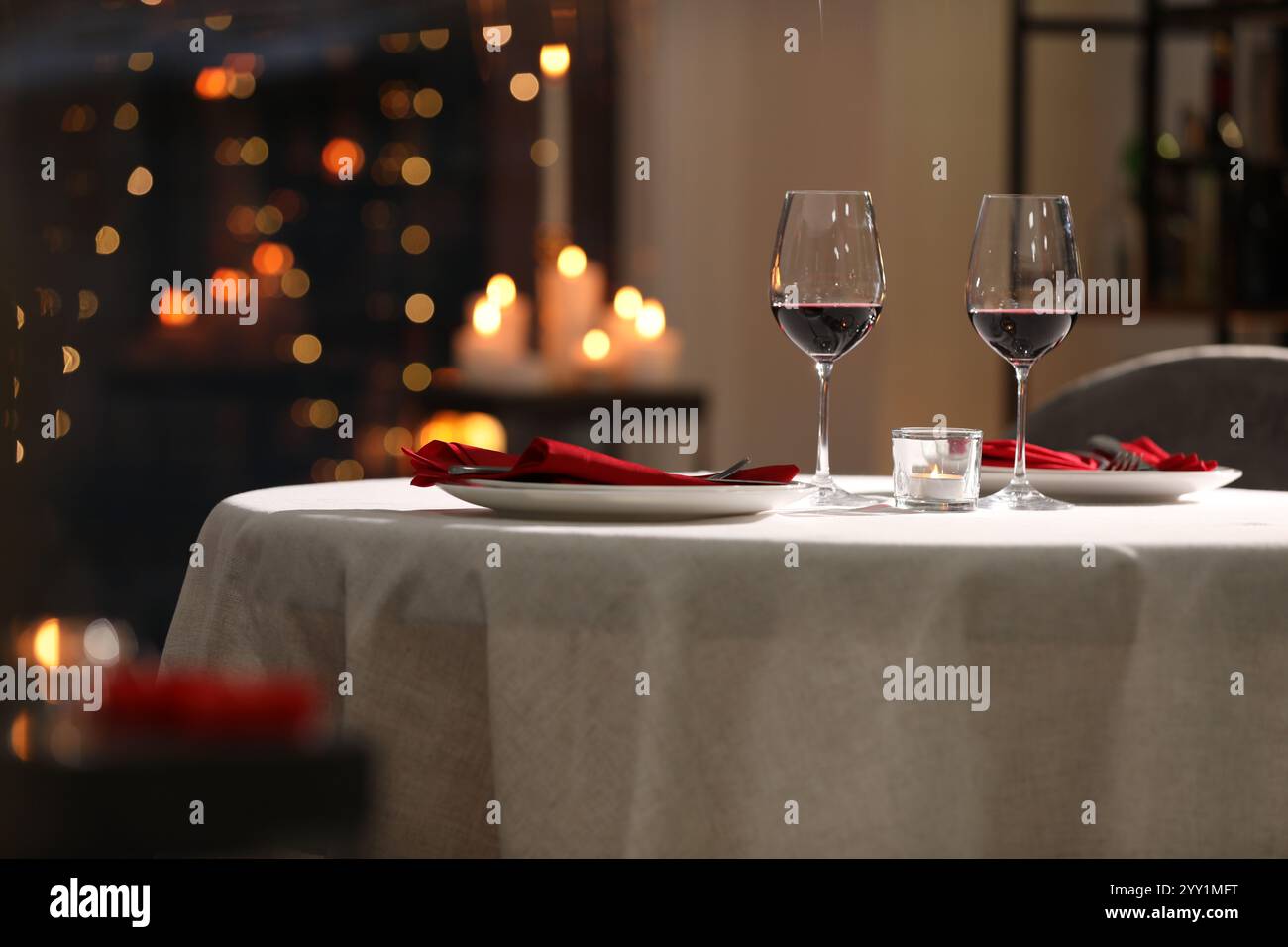 Table setting for romantic dinner in restaurant Stock Photo - Alamy