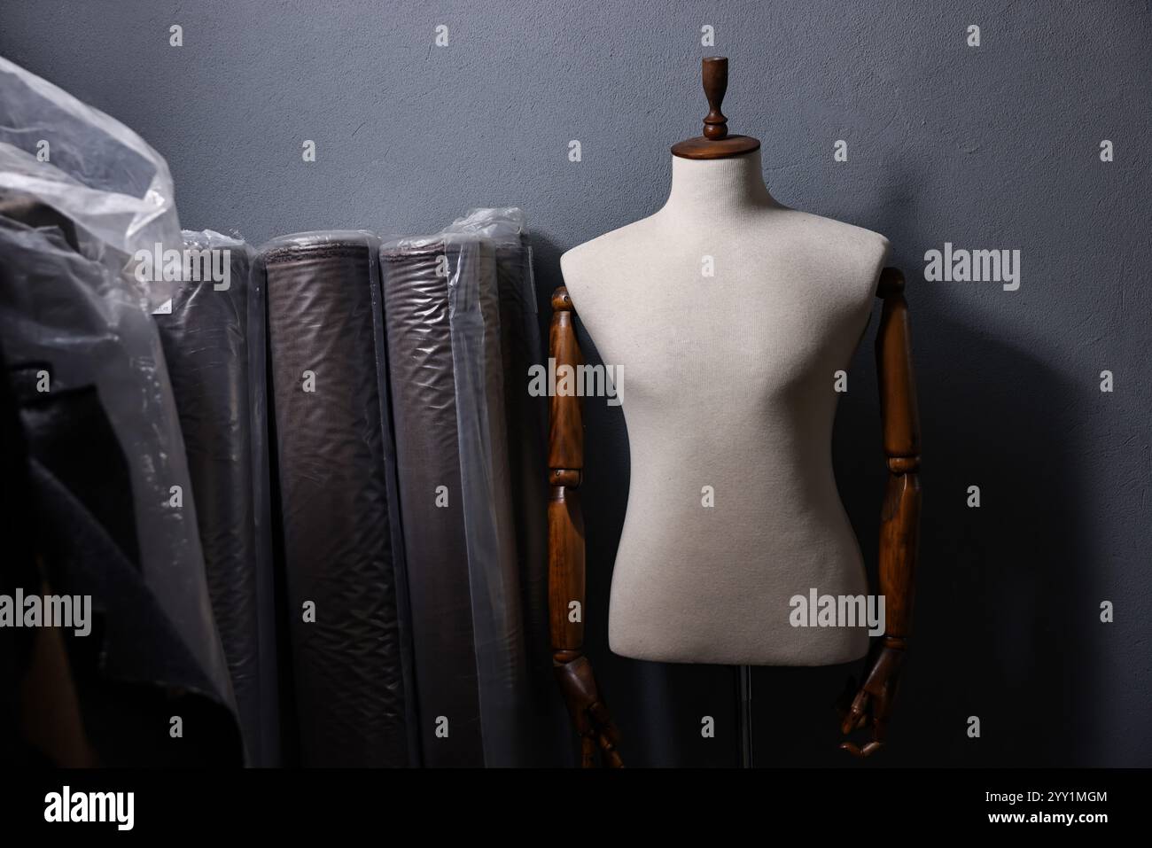 Many different types of fabric and mannequin in professional workshop ...