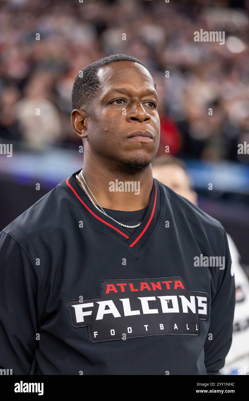 Atlanta Falcons head coach Raheem Morris stands for the national anthem ...