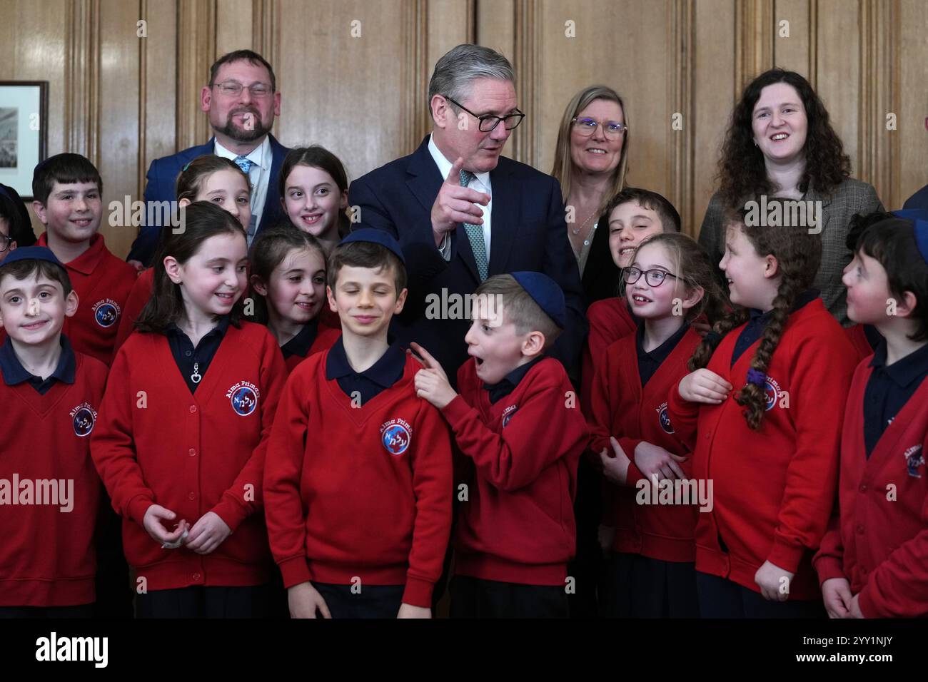 Prime Minister Sir Keir Starmer poses with the choir of Alma Primary as ...