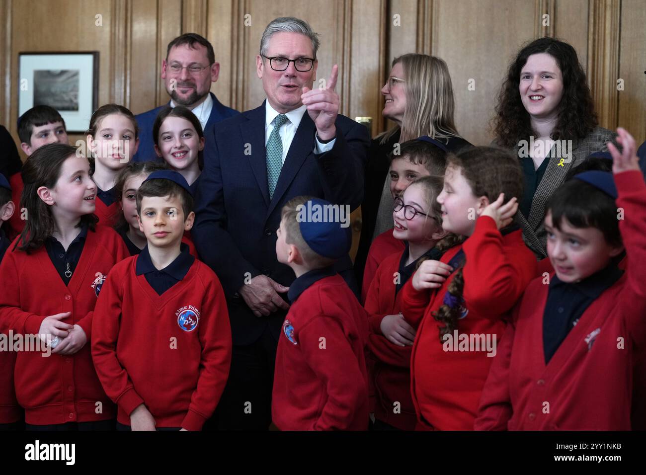 Prime Minister Sir Keir Starmer poses with the choir of Alma Primary as ...