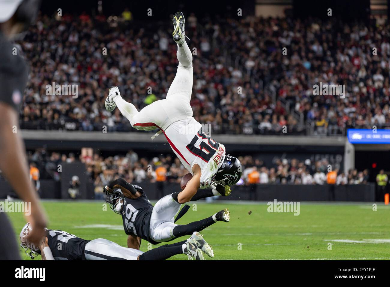 Atlanta Falcons tight end Charlie Woerner (89) is flipped after ...