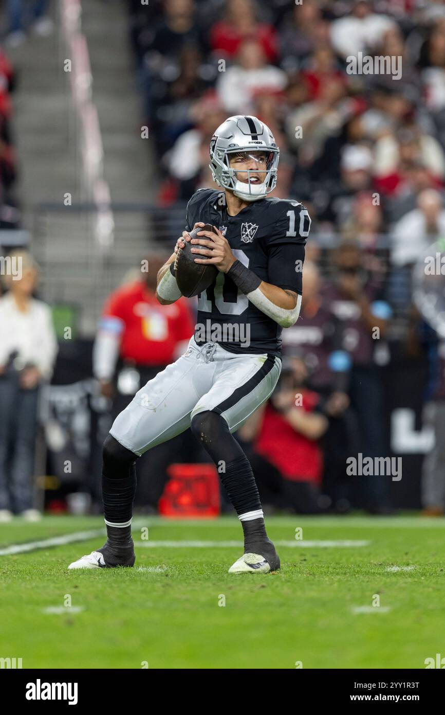 Las Vegas Raiders quarterback Desmond Ridder (10) drops back to pass ...