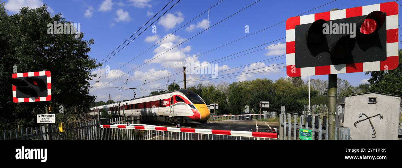 An Azuma train passing red lights at an unmanned Level crossing, East ...