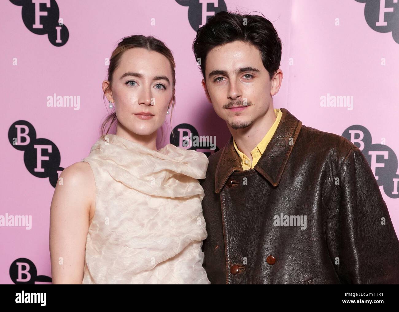 Saoirse Ronan, left, and Timothee Chalamet pose for photographers upon ...