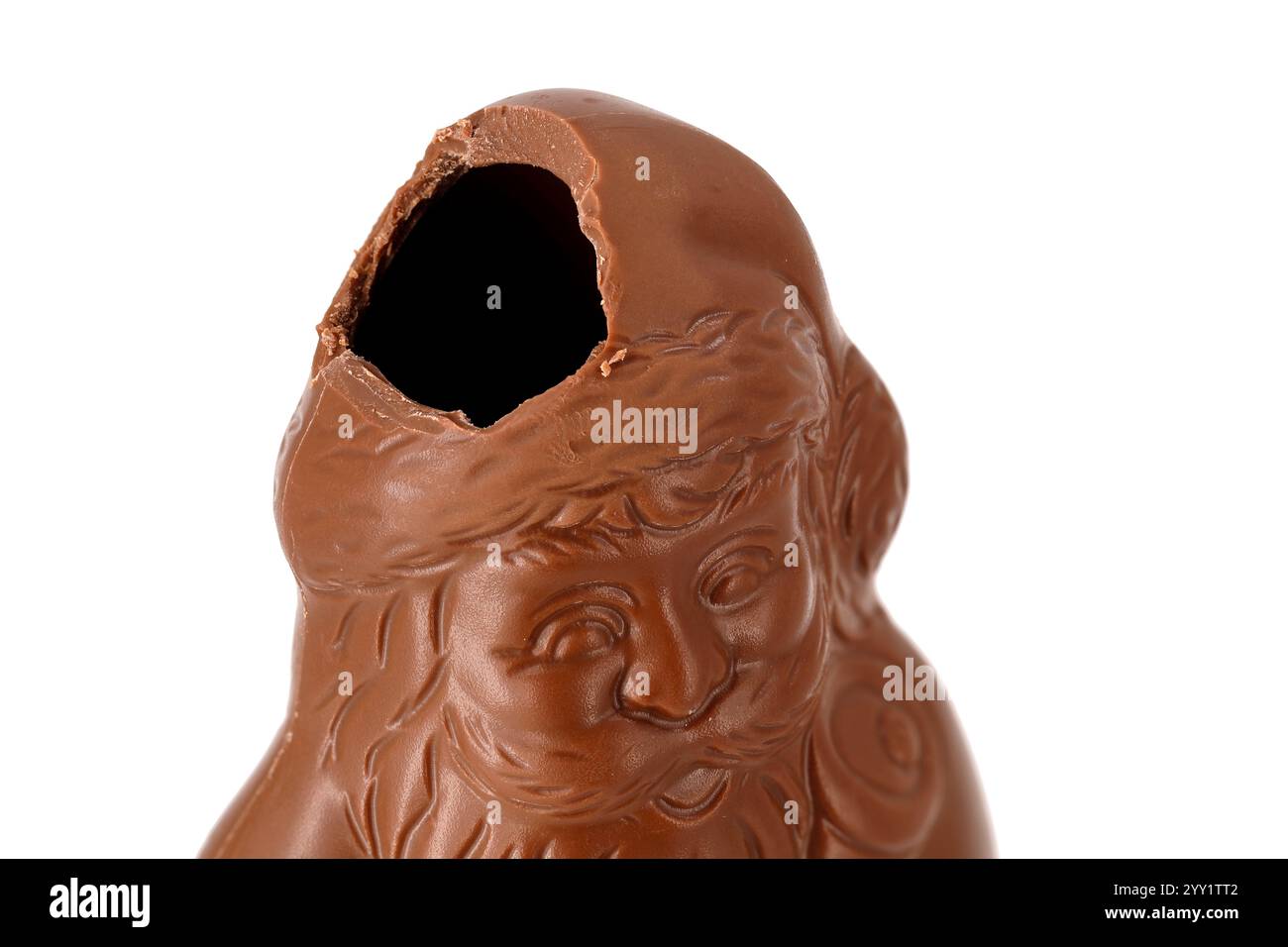 Closeup on the head of a chocolate Santa Claus with bitten off piece ...