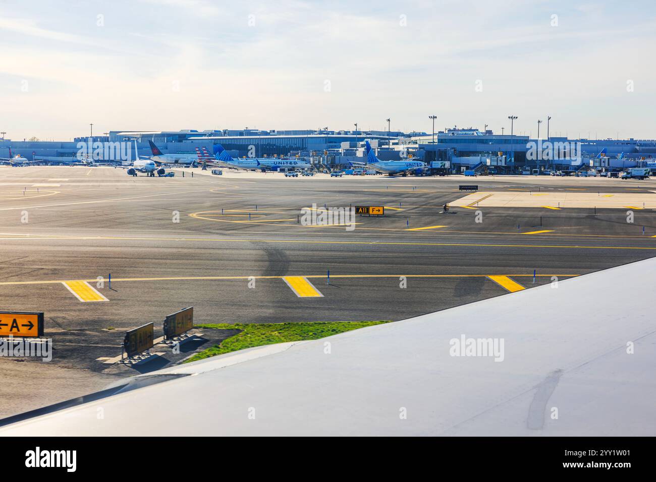 Newark Liberty International Airport runway with United Airlines and ...