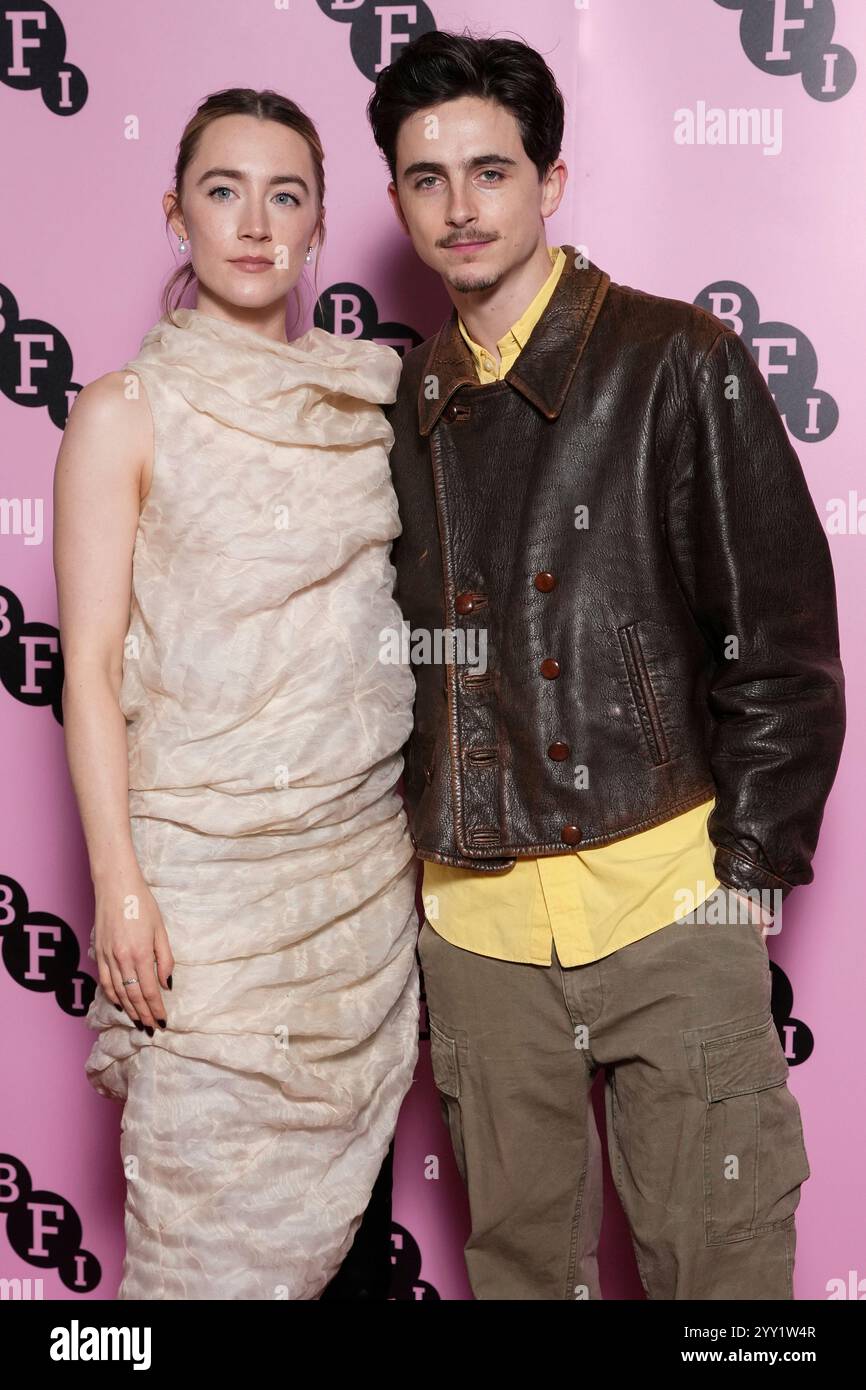 Saoirse Ronan, left, and Timothee Chalamet pose for photographers upon ...