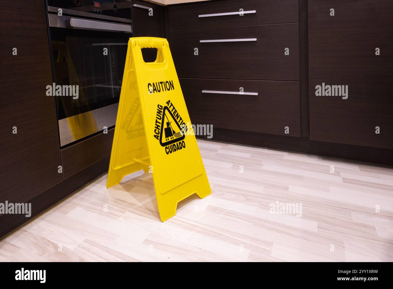 Warning for customers, slippery floor, yellow information board ...