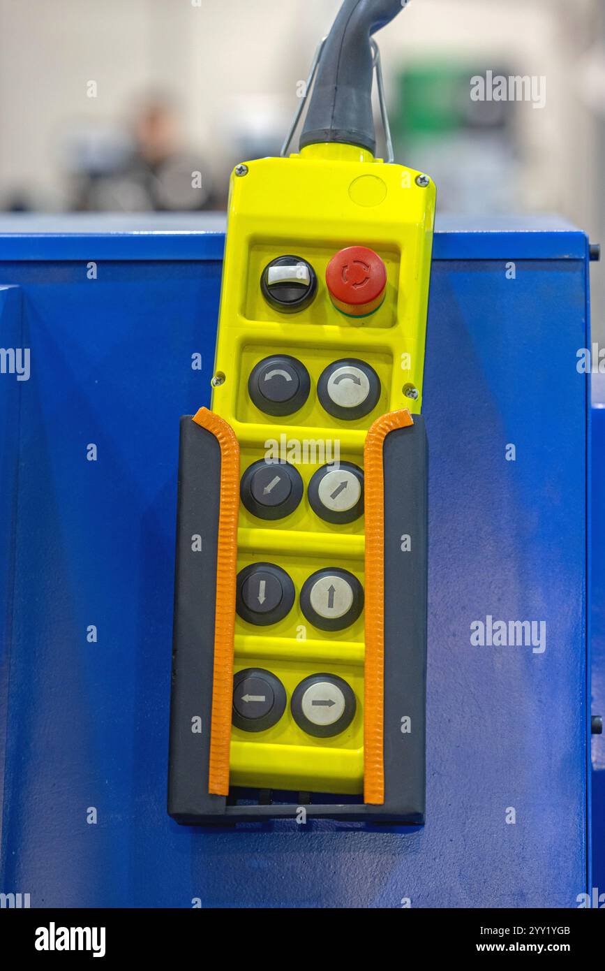 Rugged Yellow Wired Remote Control in Holder for Construction Crane ...