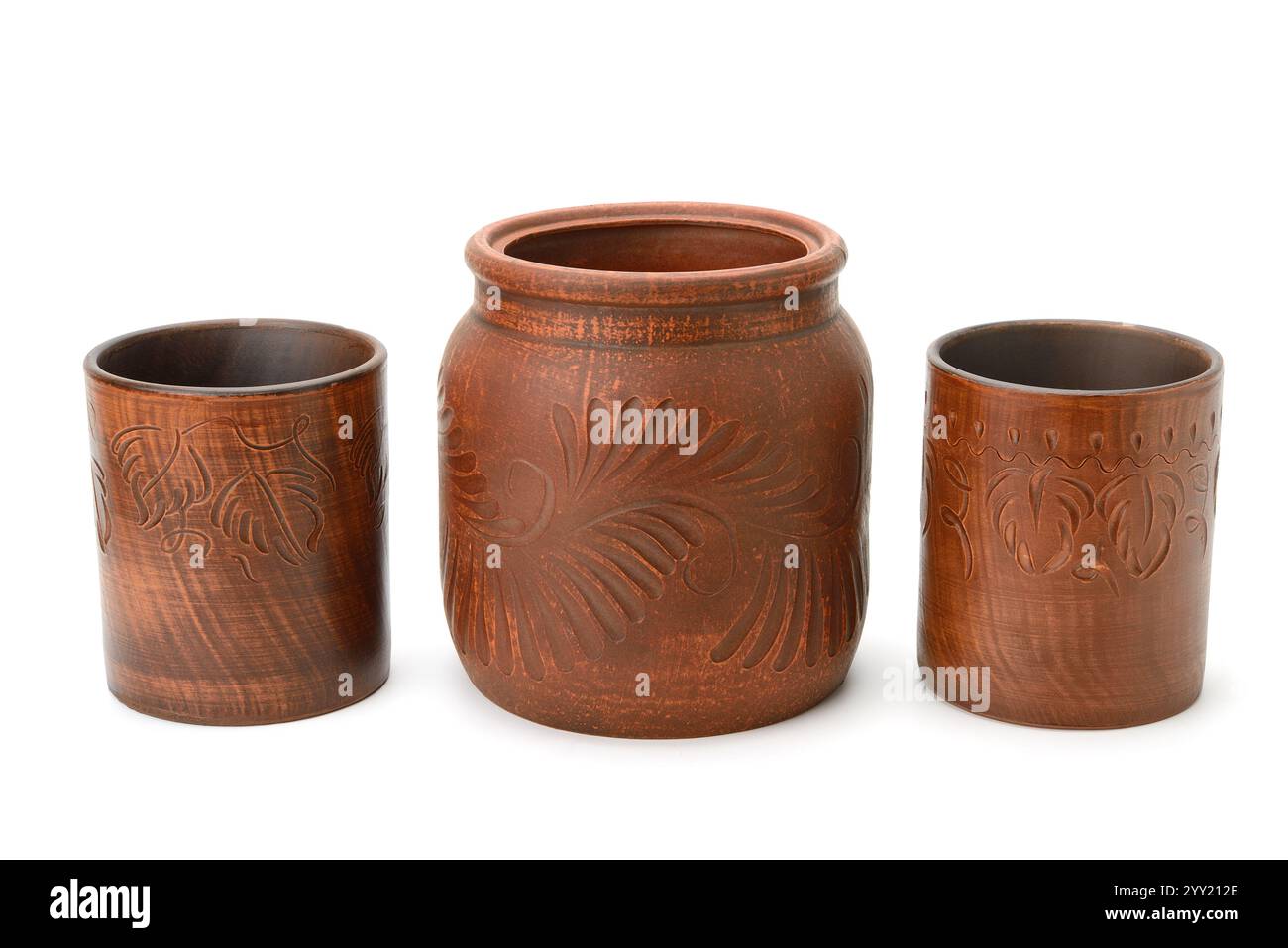 Large clay pot and cups isolated on white background Stock Photo - Alamy