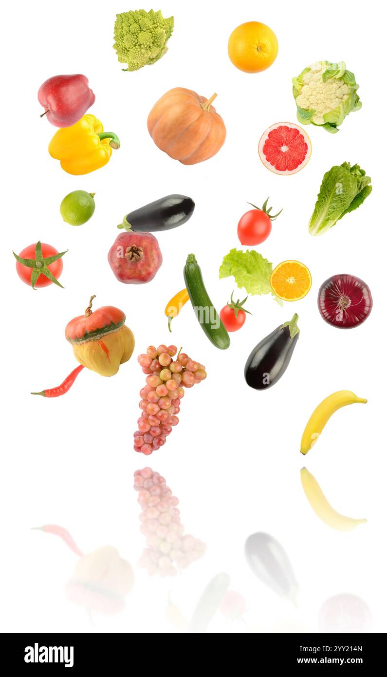 Falling fruits and vegetables with light reflection isolated on white ...