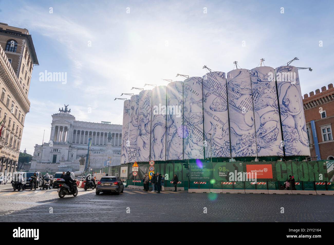View of cars passing next to "Constellations of Rome", the title of the ...