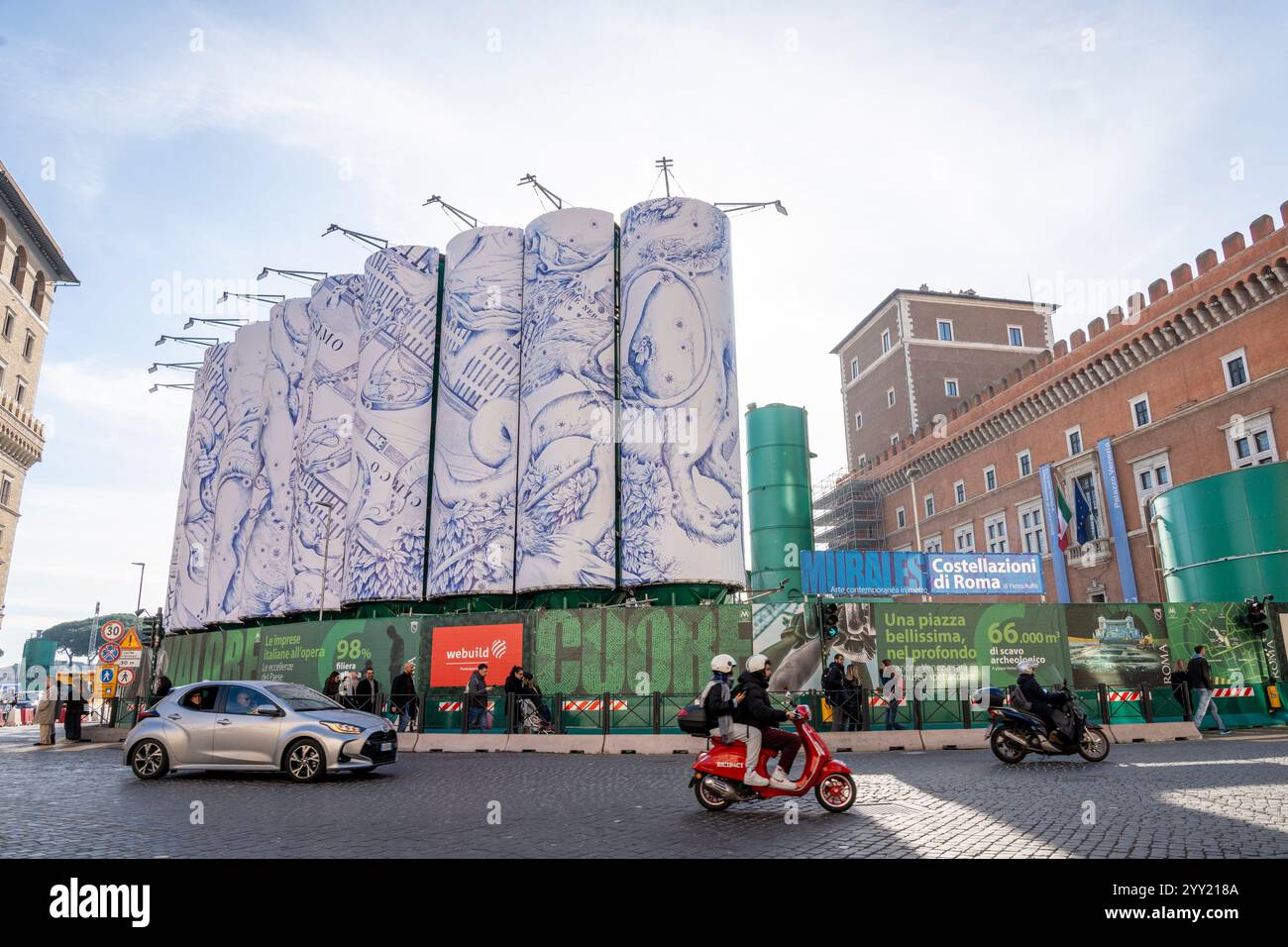 View of cars passing next to "Constellations of Rome", the title of the ...