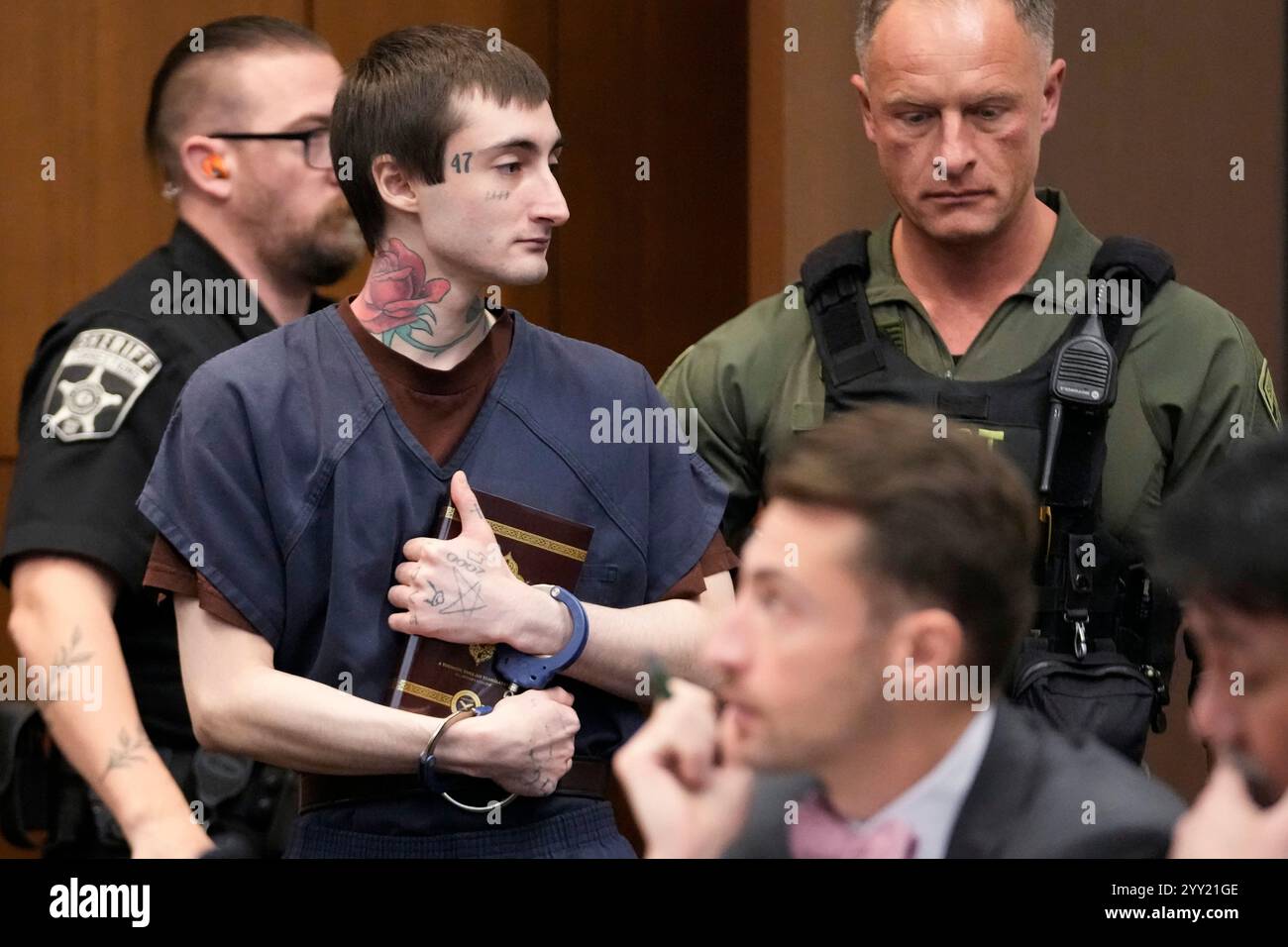 Robert E. Crimo III holds the Quran in English in court before Judge ...