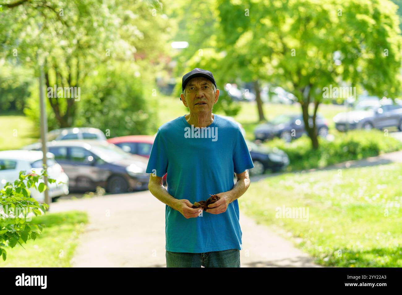 Man in cap blue shirt hi-res stock photography and images - Alamy