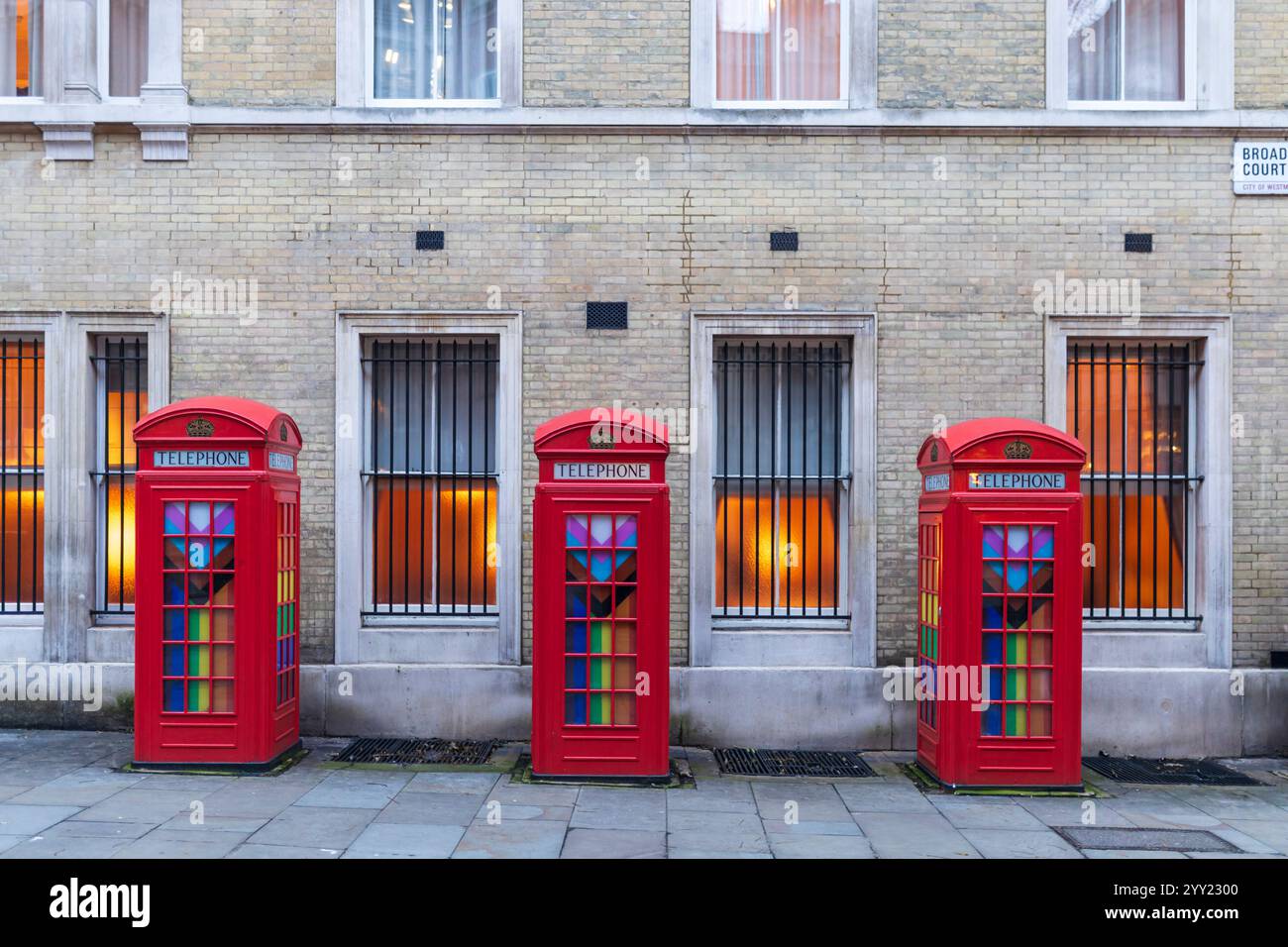 London, UK - December 2, 2024: Three red telephone booths on Broad ...