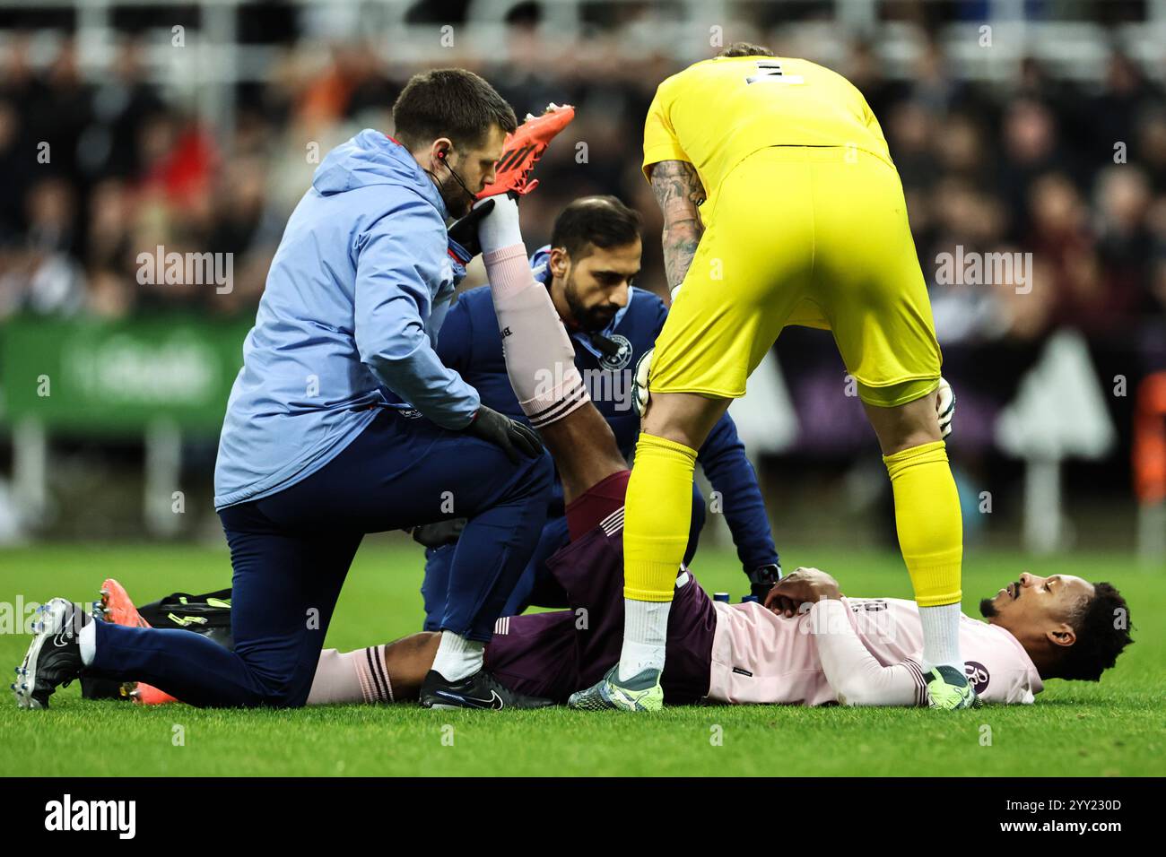 Ethan Pinnock of Brentford receives medical treatment during the ...