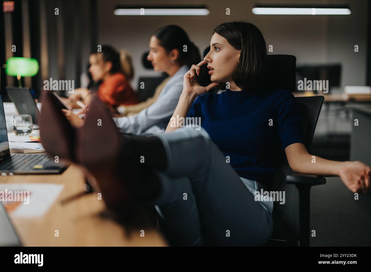 Multicultural business workers engage in a brainstorming session ...