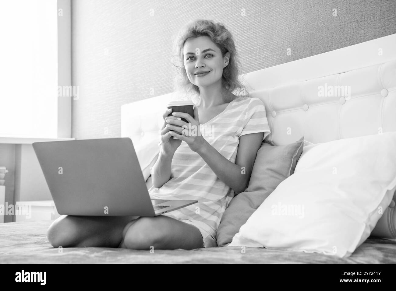 Glad woman shopping online Black and White Stock Photos & Images - Alamy