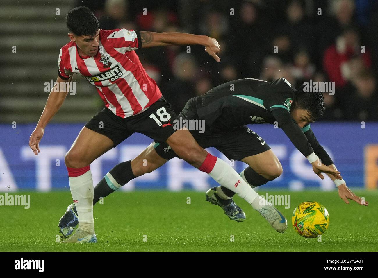 Southampton's Mateus Fernandes, left, and Liverpool's Wataru Endo fight ...