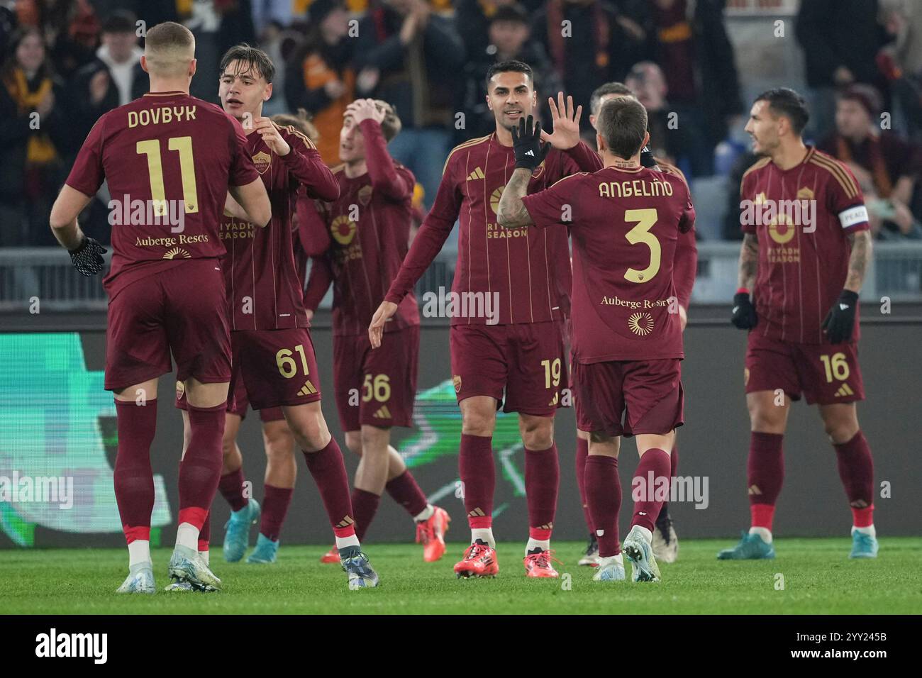 Roma's Artem Dovbyk, left, celebrates with teammates after scoring the ...