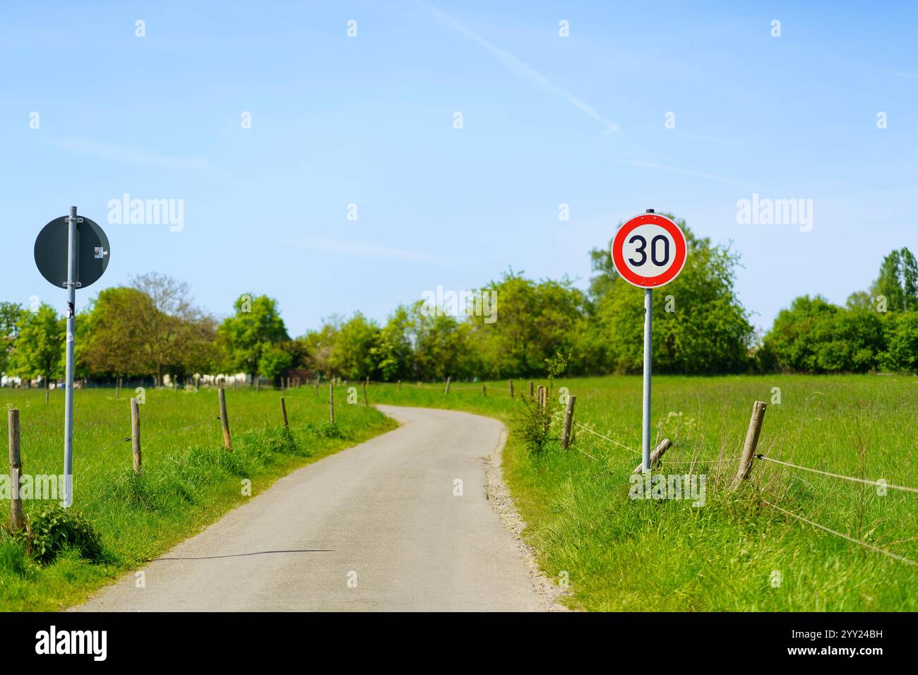 Traffic sign indicating speed limit in a rural landscape in the ...