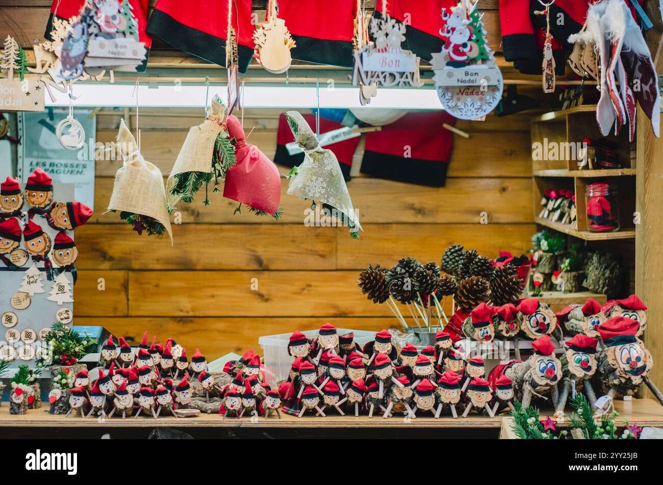 Traditional Christmas market stall with caga tio figures and festive ...