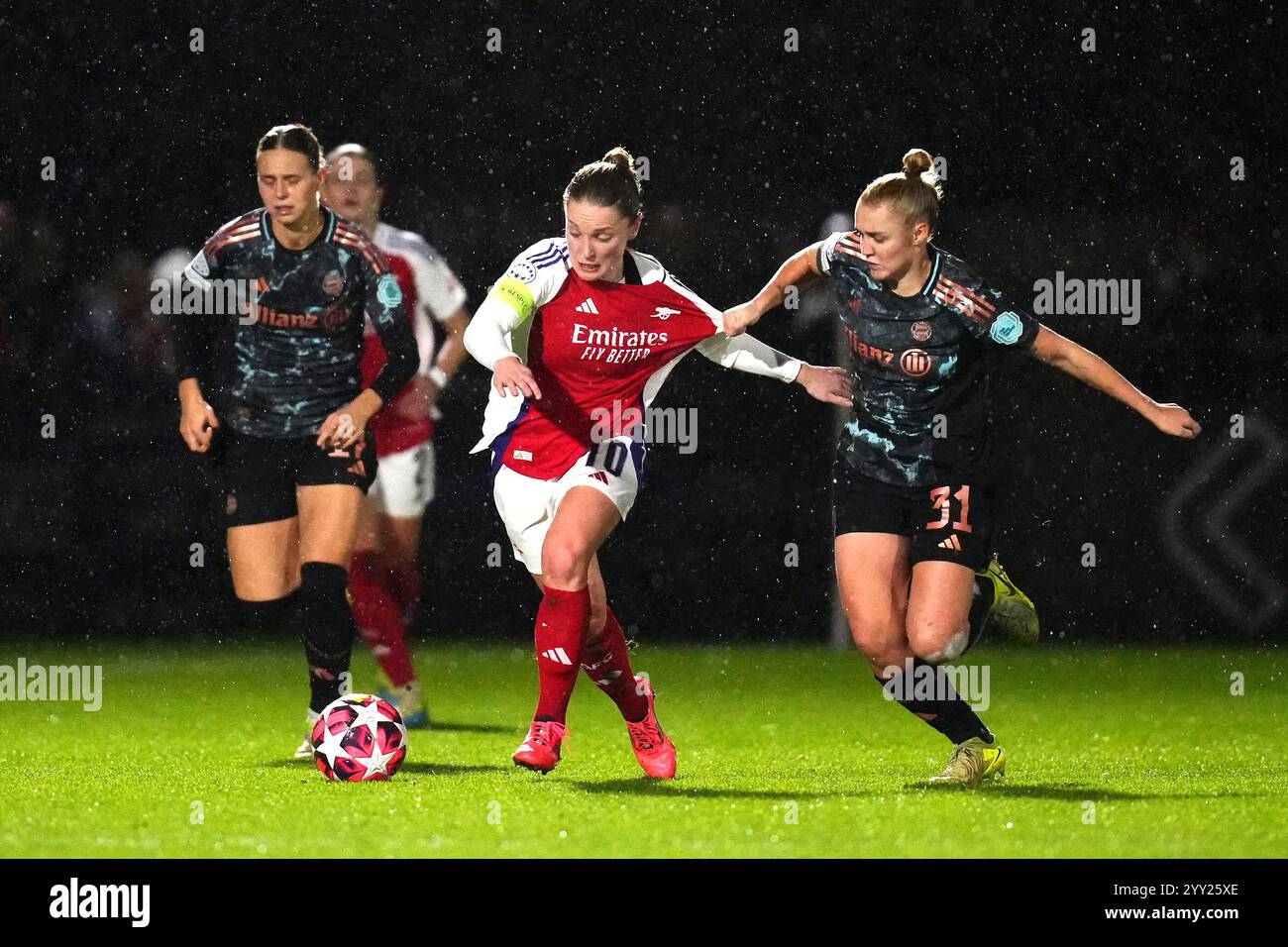 Arsenal's Kim Little and Bayern Munich's Georgia Stanway (right) battle ...