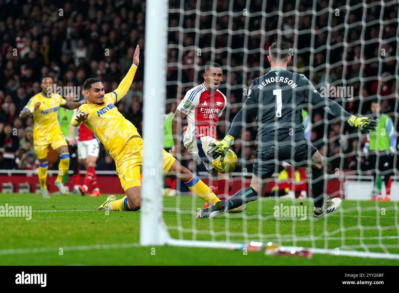 Crystal Palace goalkeeper Dean Henderson (right) makes a save from ...