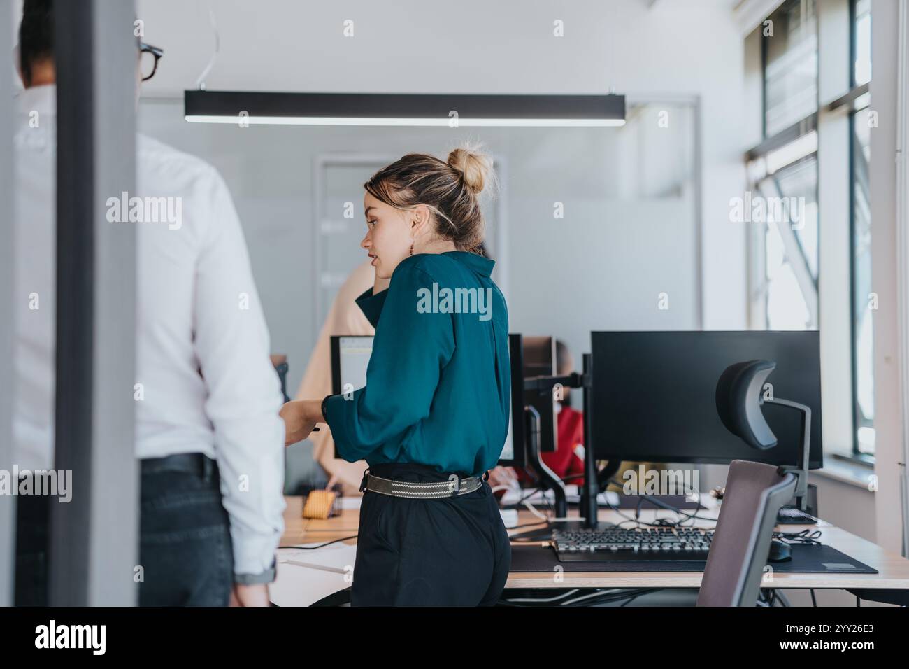 Multicultural team collaborating in modern office environment Stock ...