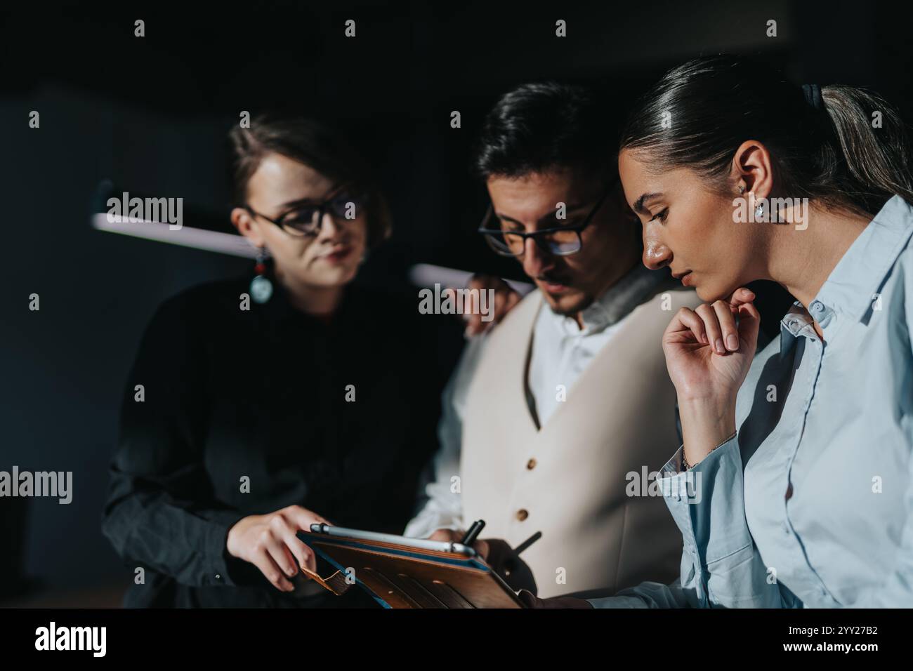 Business people reviewing documents in a modern workspace Stock Photo ...