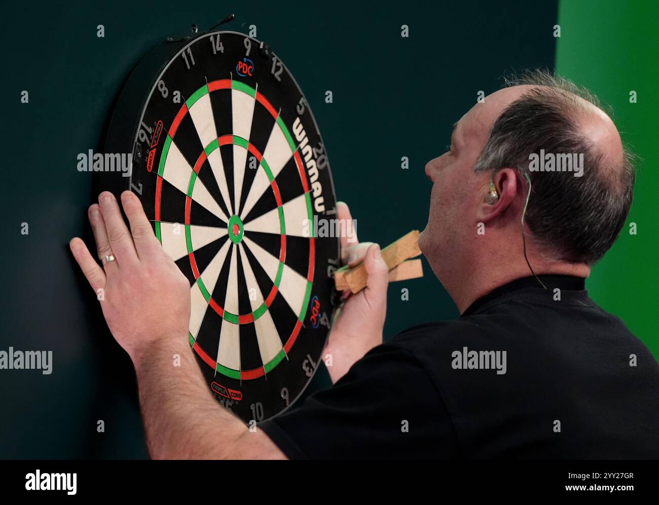A judge changes the dart board during day four of the Paddy Power World ...